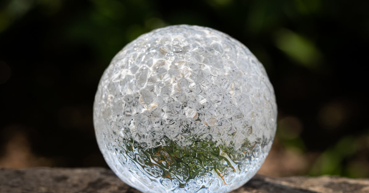 cleargolfball.jpg?crop=center&height=630&v=1624384916&width=1200